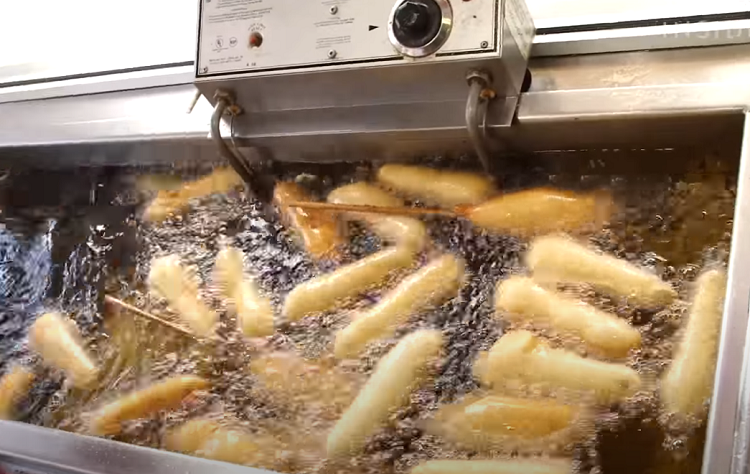 The Dilly Dog: a baseball-stand born dill pickle-stuffed corn dog ...