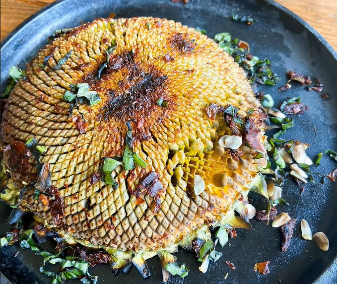 People are grilling whole sunflower heads like corn on the cob and it's ...