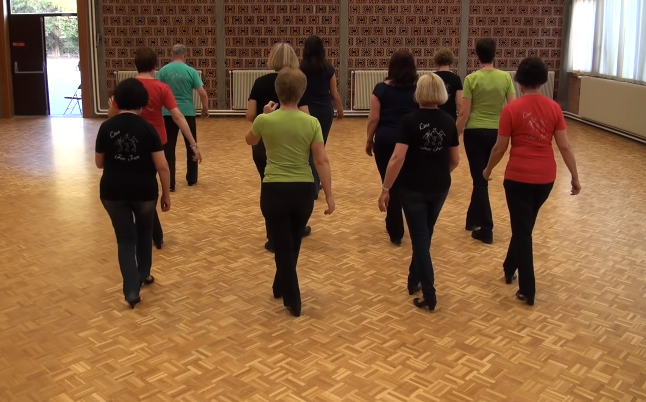 Seniors don’t hold back with “Let’s Twist Again” line dance