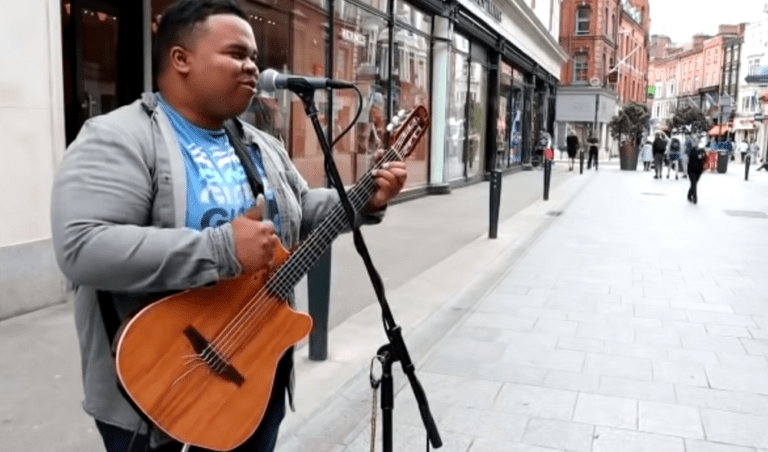 Acoustic busker plays smooth cover of Bee Gee’s “How Deep is Your Love”