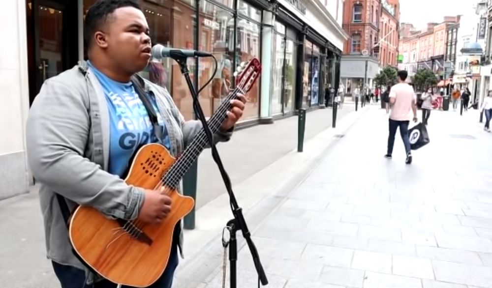 Acoustic busker plays smooth cover of Bee Gee’s “How Deep is Your Love”