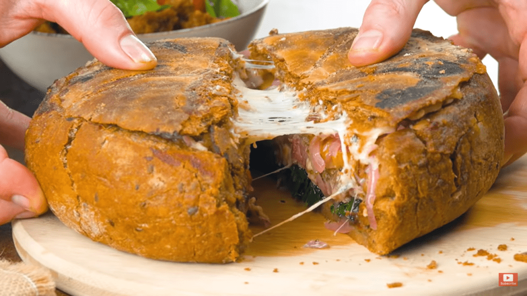 Carve out the inside of a loaf of bread then fill it with these 6 ...