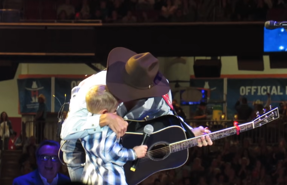 George Strait beautifully sings “God and Country Music” with grandson