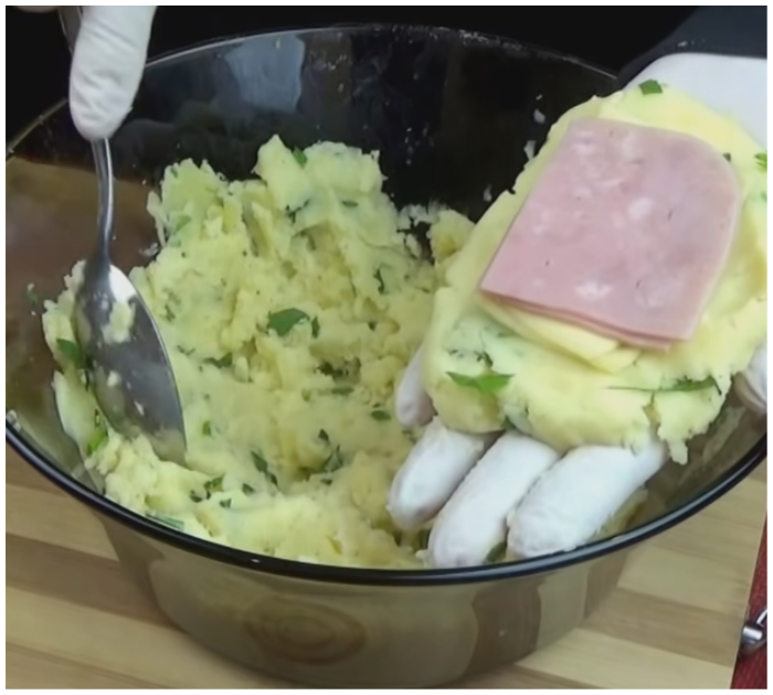 Woman mixes potatoes and cheese for delicious dinner idea