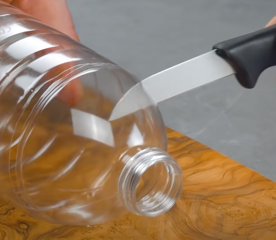 Man fills a plastic bottle then demonstrates easy way to make a ...