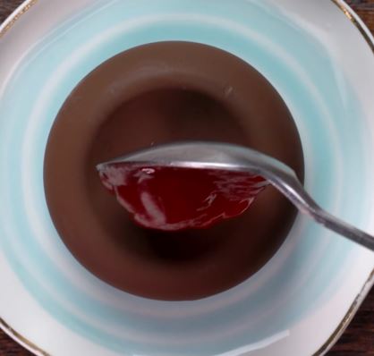 Pour chocolate into a balloon to create a dessert popping with ...