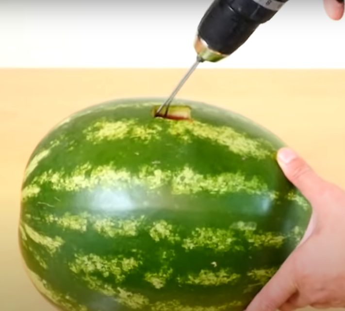 Man Inserts Hanger In Watermelon For Delicious And Hilarious Summer Treat