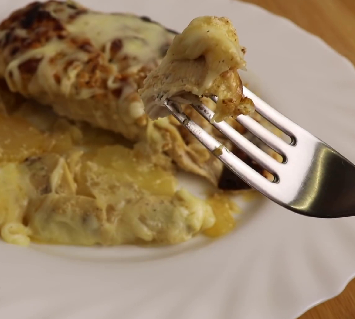 Cook cuts diamond pattern into chicken breasts and dips in sauce for ...