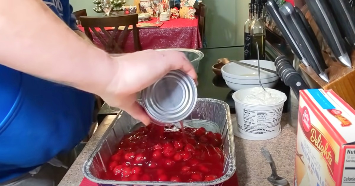 Dump 2 cans of cherries in a baking pan to make cherry cheesecake that ...