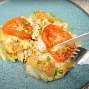 Pours beaten eggs over chicken and potatoes for tasty one-pan dinner