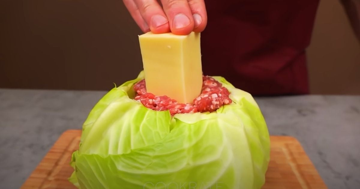 Chef wraps bacon around cabbage stuffed with cheese and ground beef for ...
