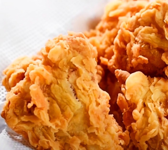 Dip eggs in flour and cook in oil to make chickenless “fried chicken”