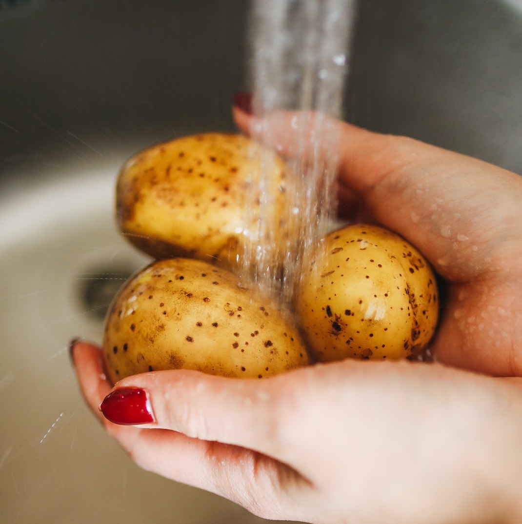 Press balls of mashed potatoes with a glass bottle for a delicious ...