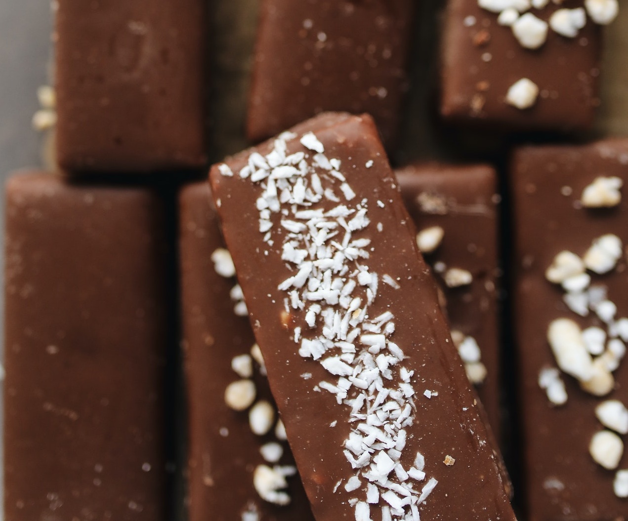 Woman layers chocolate cake with thick coconut filling for delicious ...