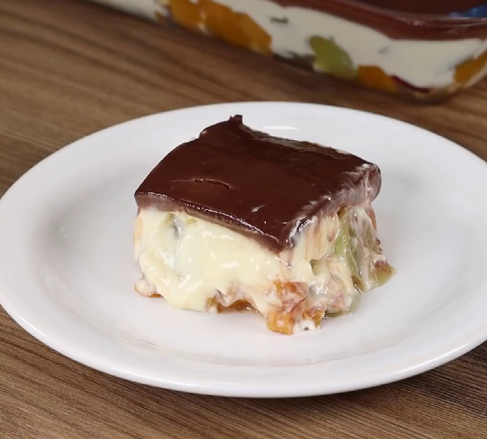 Mom lines a tray with fruit then dumps delicious cream on top for the ...