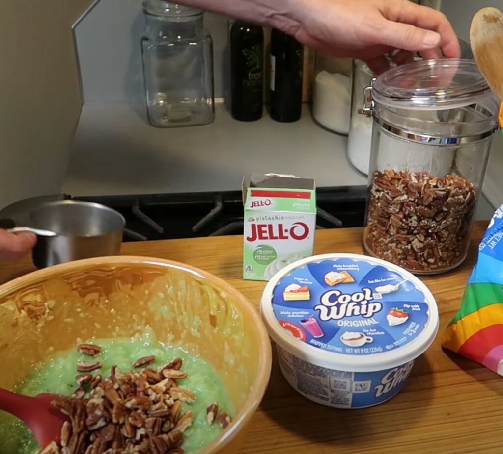 Grandpa mixes pineapples and pudding for “frozen green fluff” dessert ...