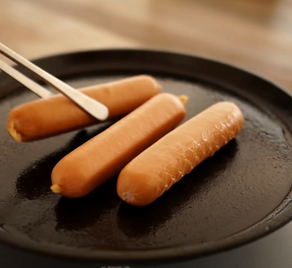 Rice-wrapped hot dog recipe grilled up with a cheesy center gets over ...