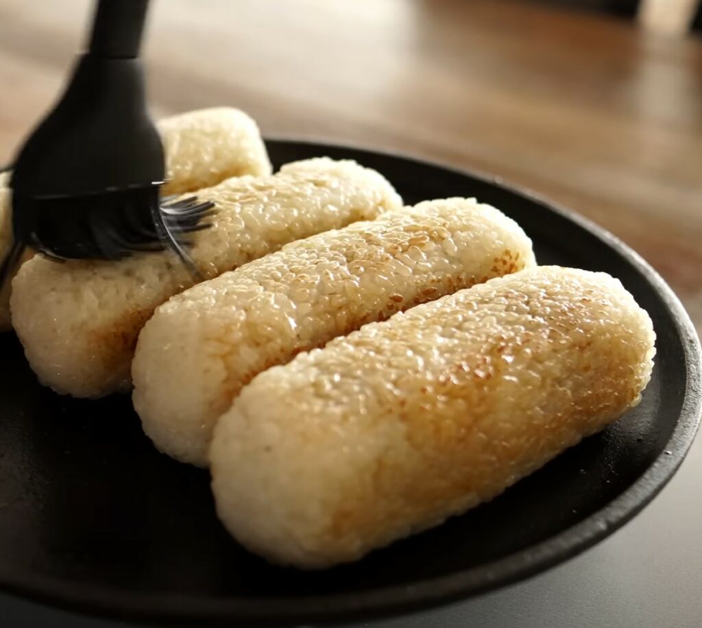 Rice-wrapped hot dog recipe grilled up with a cheesy center gets over ...