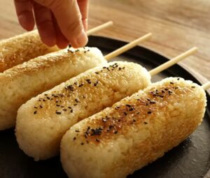 Rice-wrapped hot dog recipe grilled up with a cheesy center gets over ...