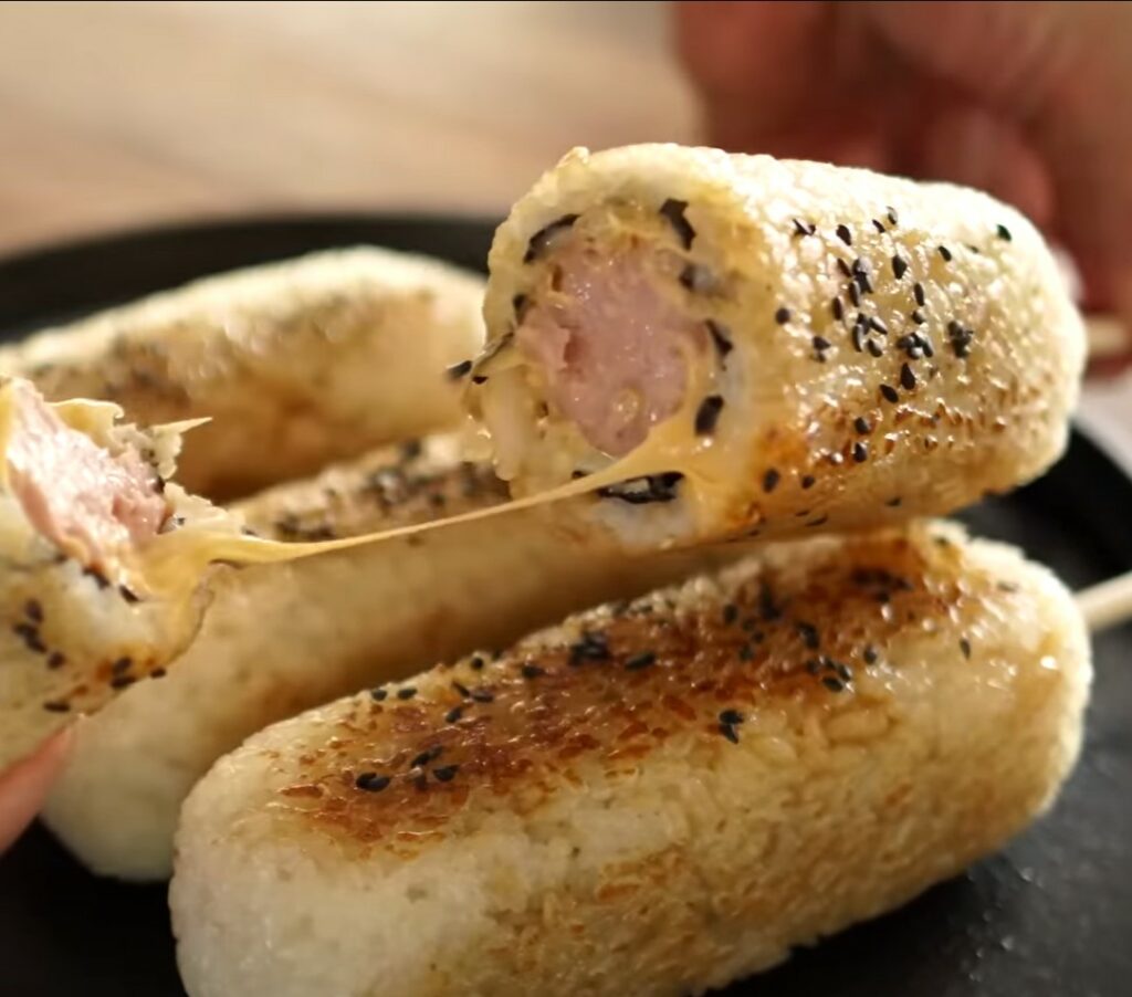 Rice-wrapped hot dog recipe grilled up with a cheesy center gets over ...