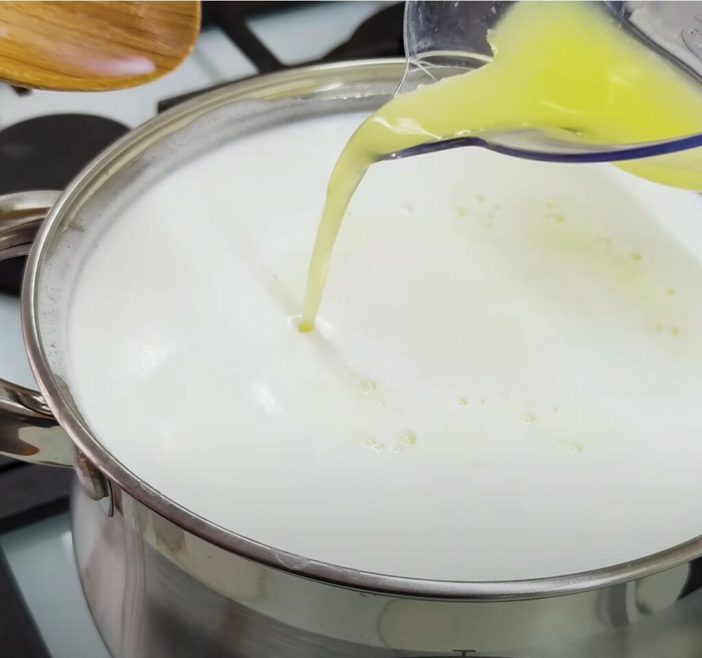 Woman pours juice of 1 lemon into salted milk to make delicious 3 ...
